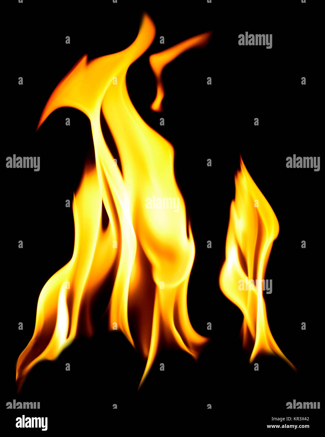 Yellow hot wavy flames over coals with black background for concepts ...