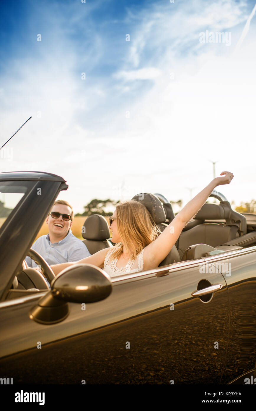 couple in convertible looks in love Stock Photo - Alamy