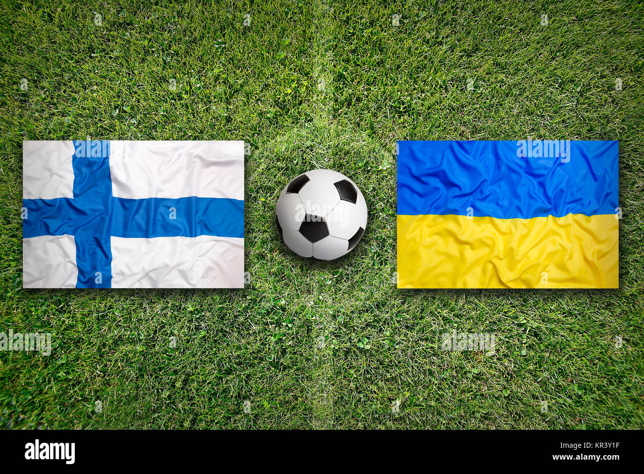 Finland vs. Ukraine flags on soccer field Stock Photo - Alamy