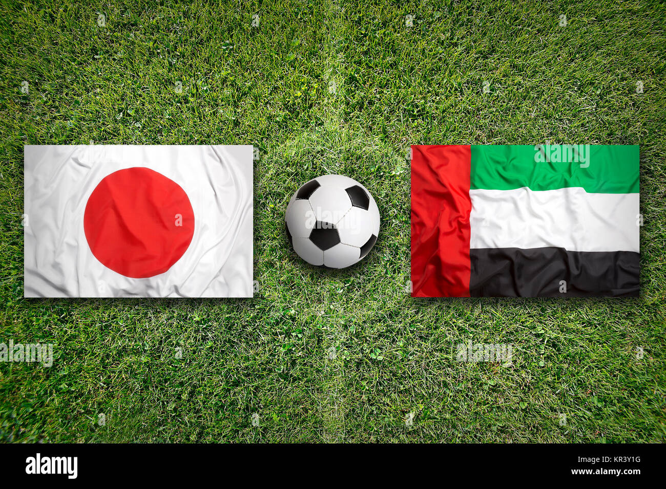 Japan vs. United Arab Emirates flags on soccer field Stock Photo - Alamy