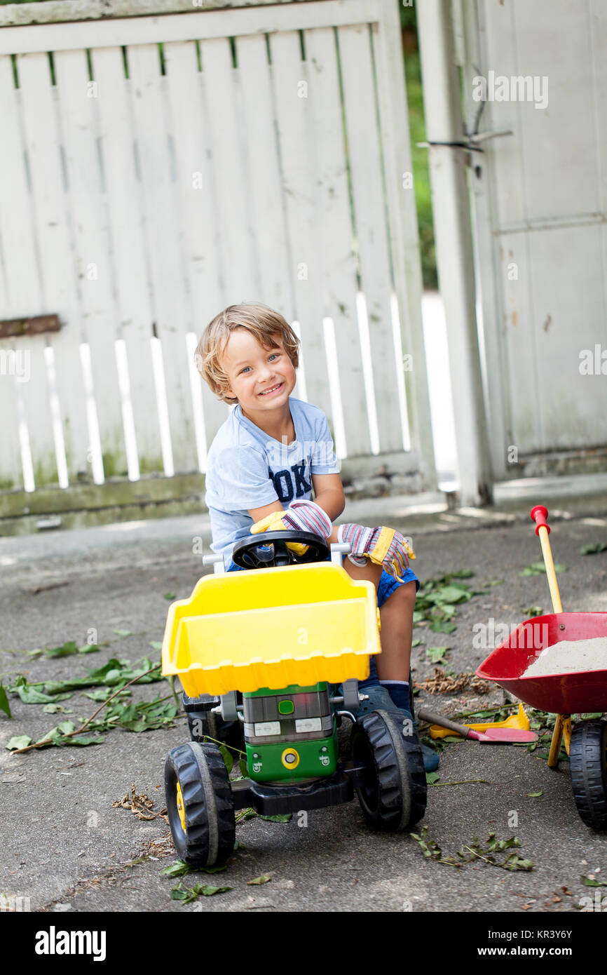 little boy on his toy tractor Stock Photo - Alamy