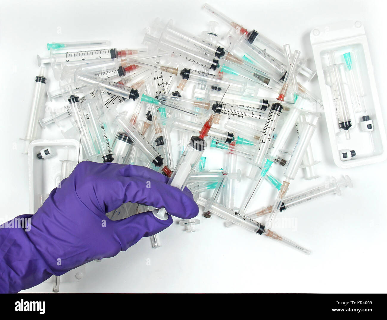 Hand syringes pile Stock Photo - Alamy