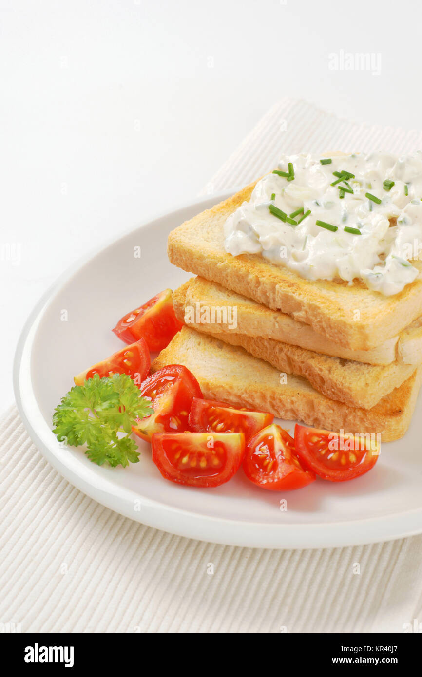 toasted white bread and creamy chives spread Stock Photo - Alamy