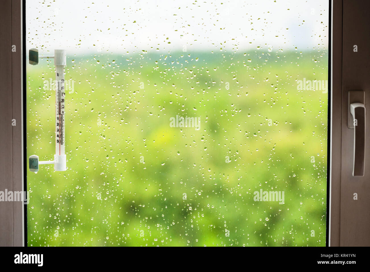 home window with rain drops and thermometer Stock Photo - Alamy