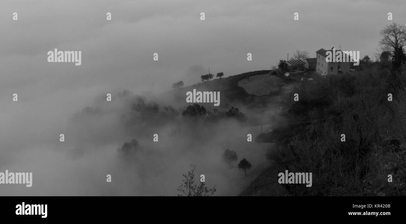 House with approaching fog Stock Photo - Alamy