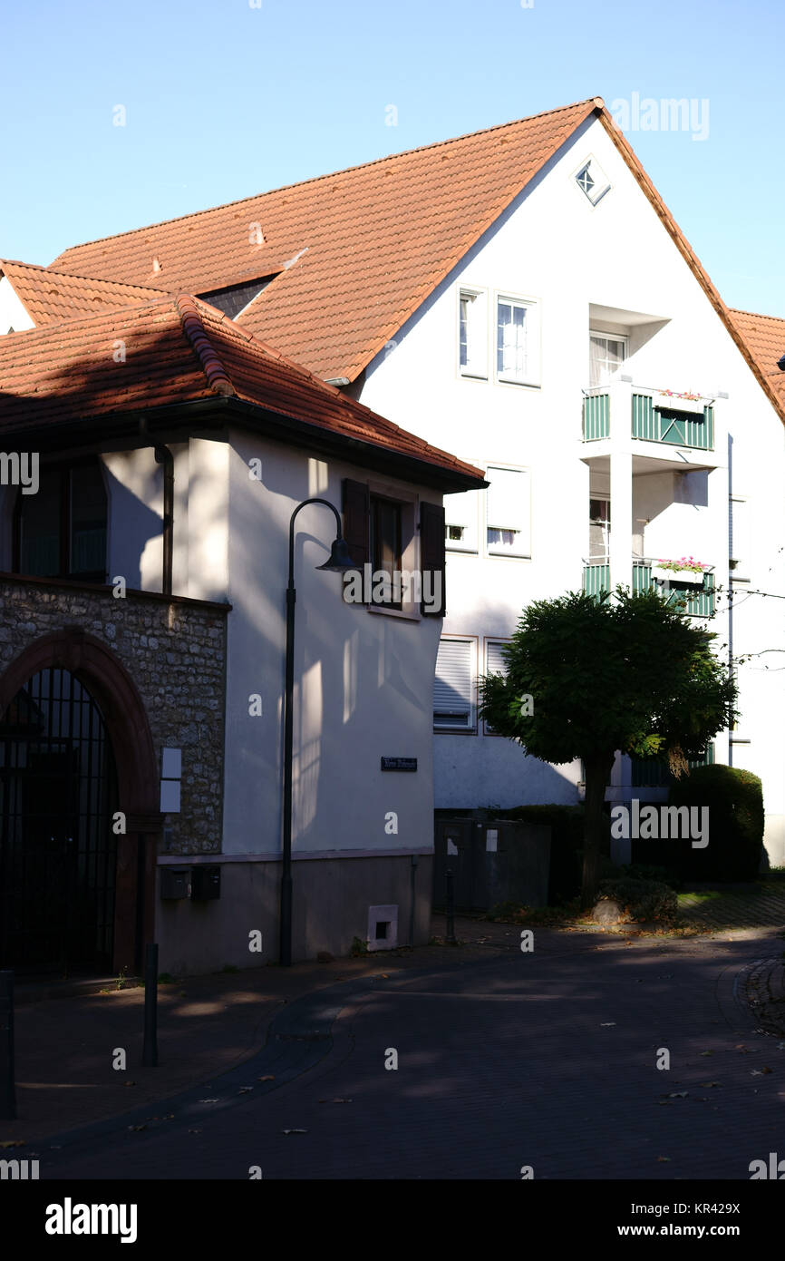 A narrow lane and driveway between residential buildings Stock Photo ...