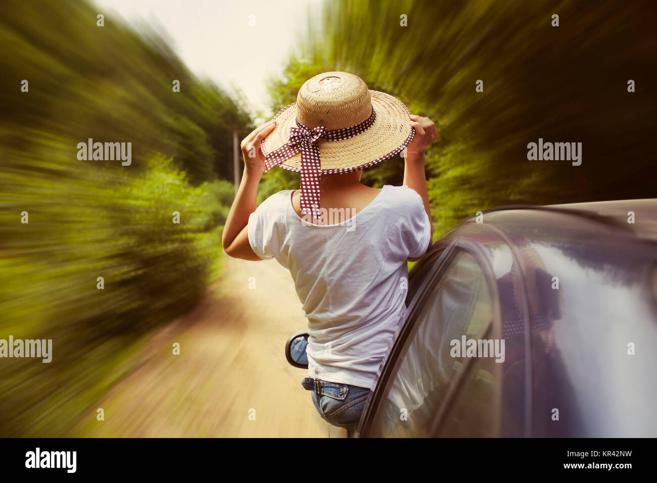 Young girl siting in a car's window Stock Photo - Alamy