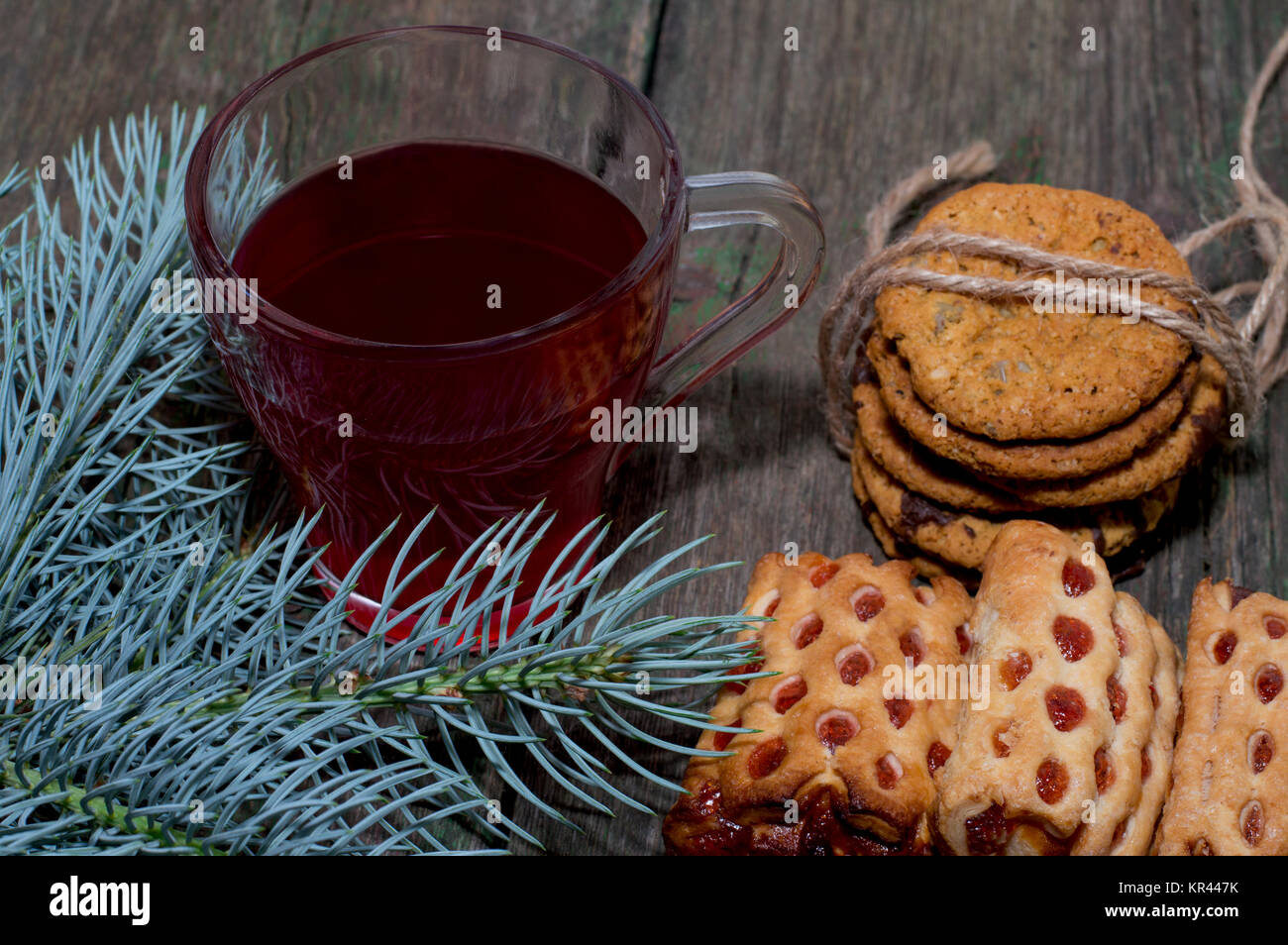cup of tea, fir-tree branch and two linking of cookies Stock Photo - Alamy
