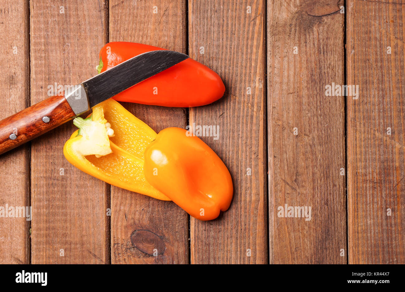 Small bell peppers in red and orange Stock Photo - Alamy