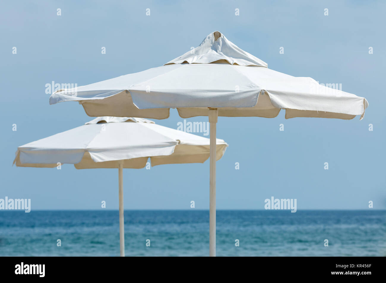 Two white parasol Stock Photo - Alamy