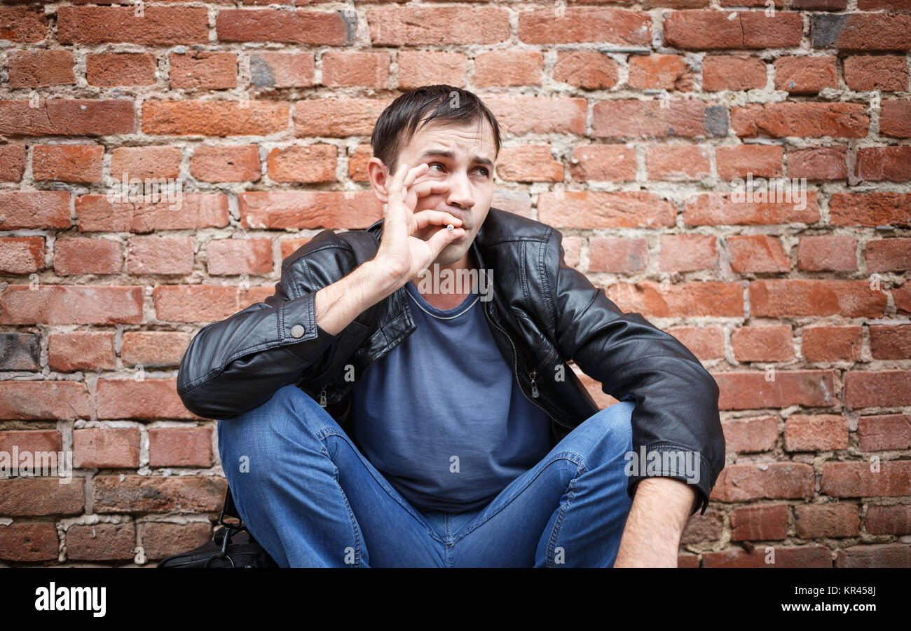Squatting male model hi-res stock photography and images - Alamy