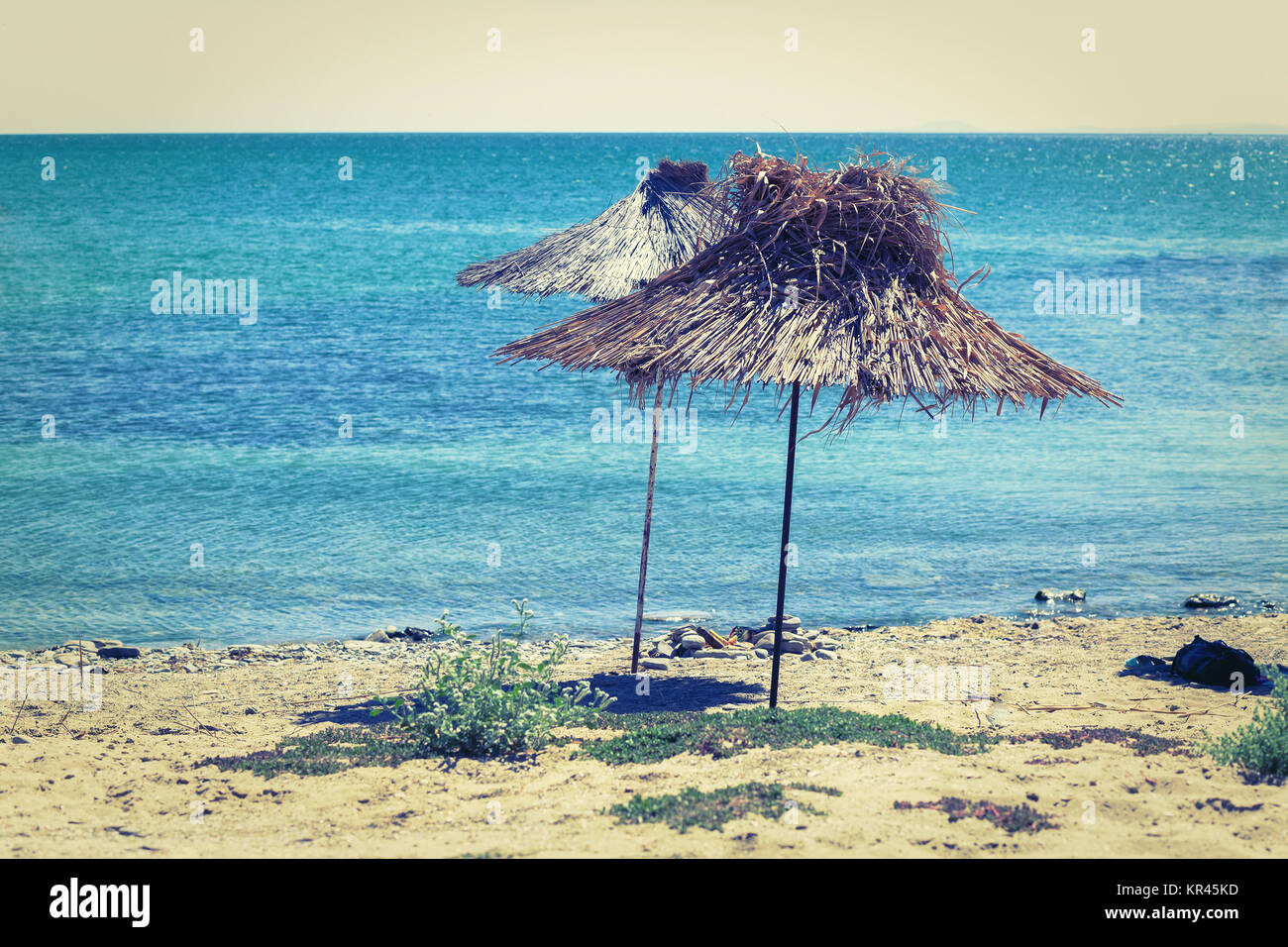 Straw beach umbrellas Stock Photo - Alamy
