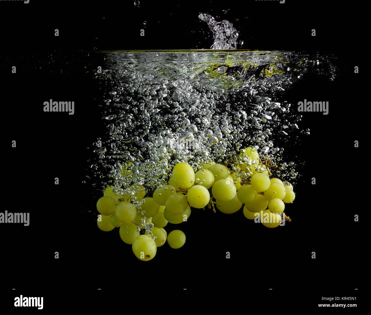 Green grapes in water Stock Photo - Alamy
