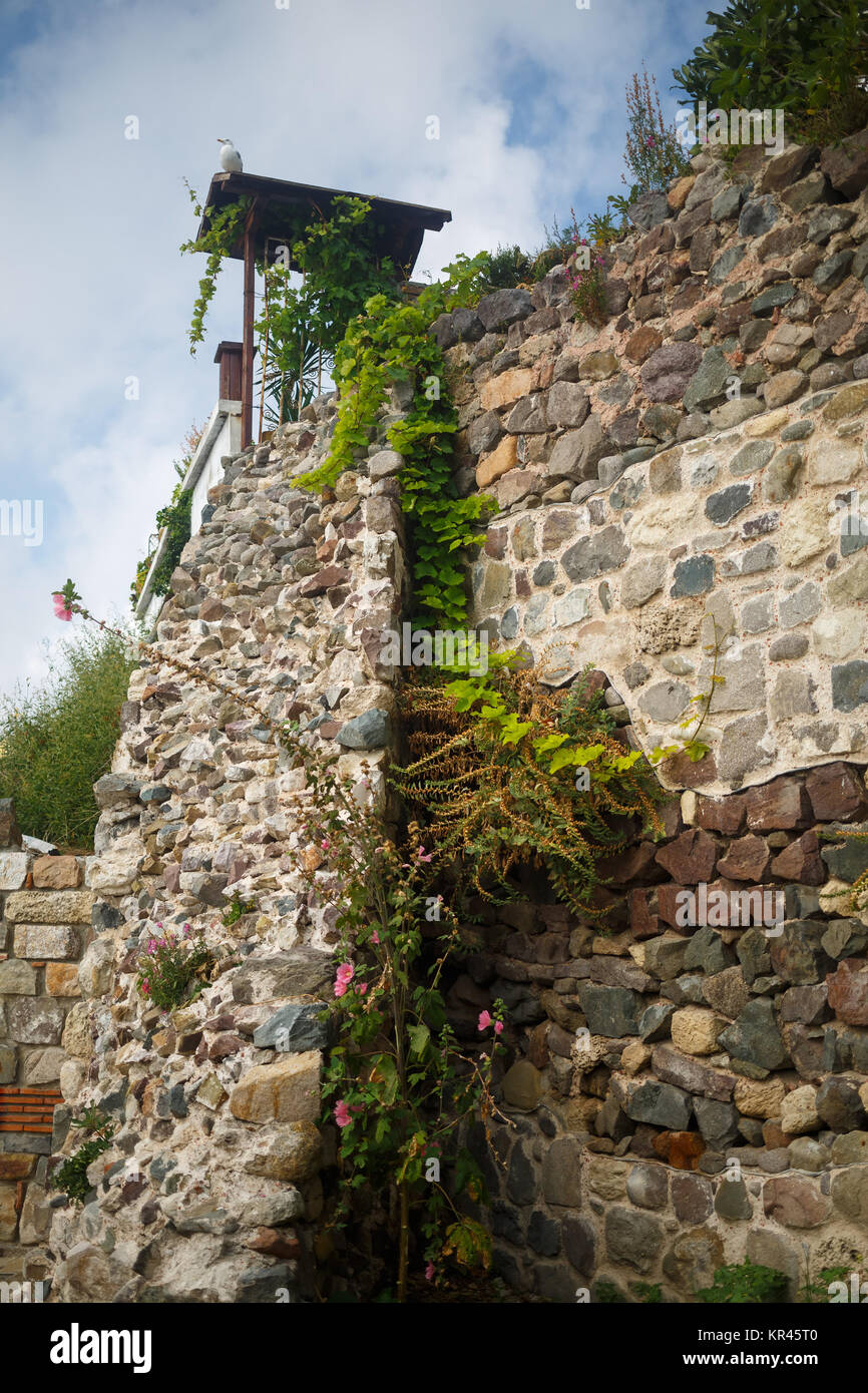 High stone wall Stock Photo - Alamy