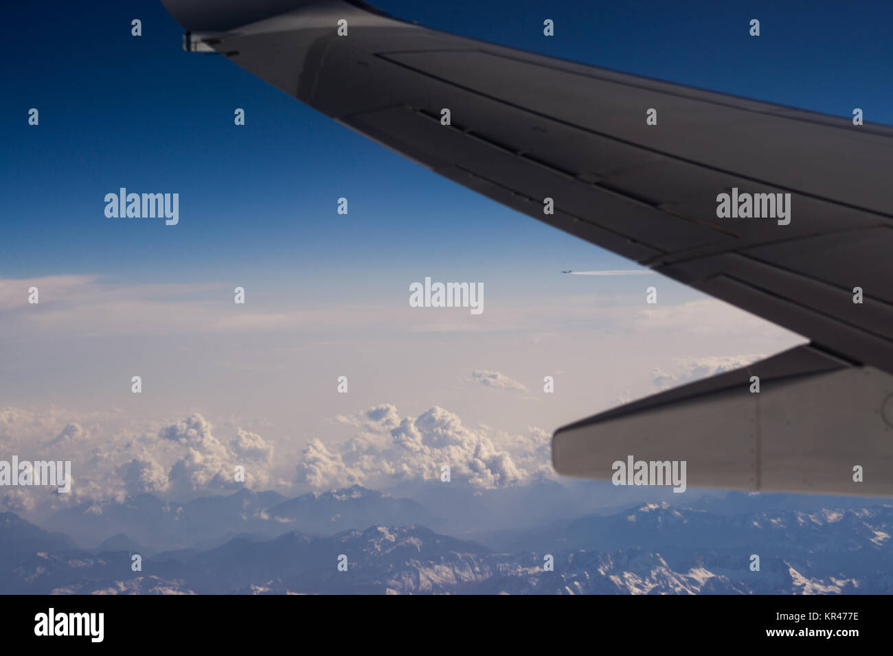 Flying over the Alps. An aerial view from the airplane over the ...