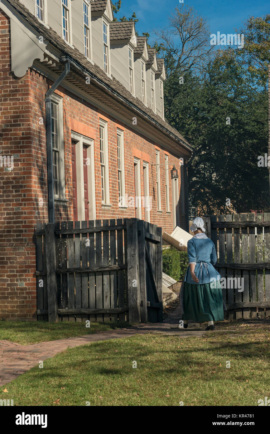 Costumed interpreter entering backyard of George Wythe house Stock ...