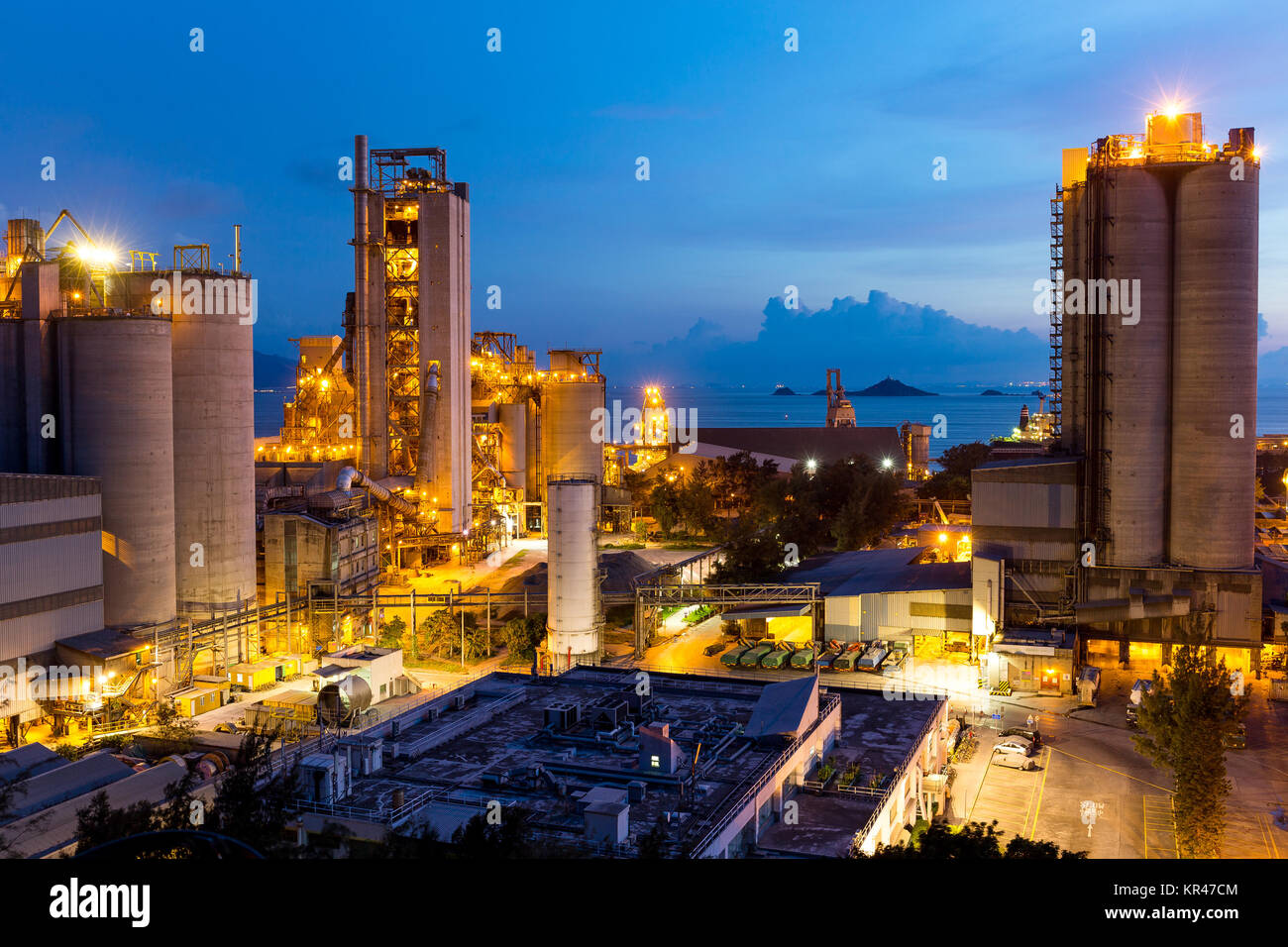 Cement plant at sunset Stock Photo - Alamy