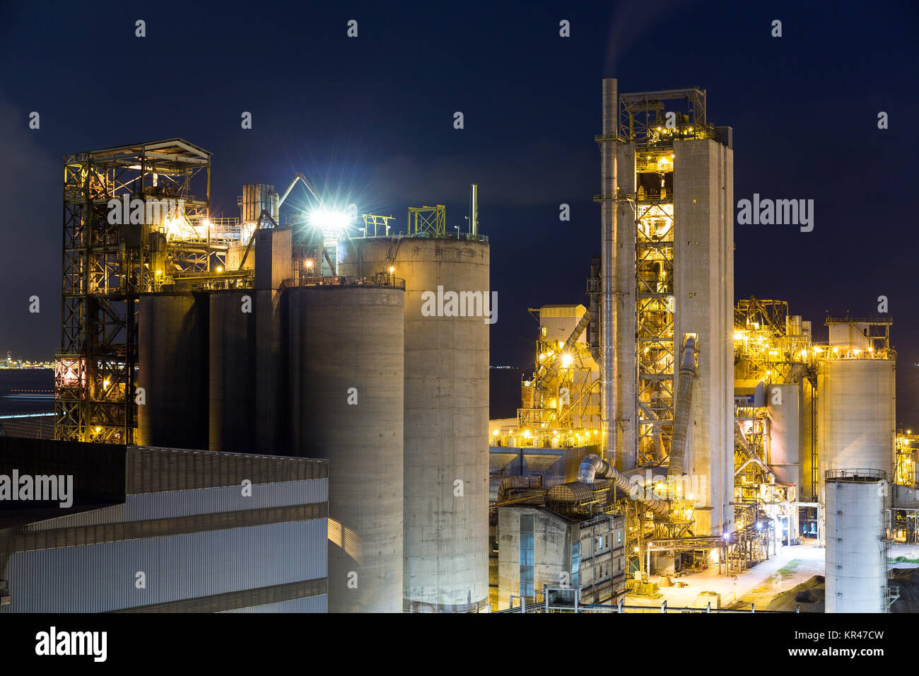 Cement factory at night Stock Photo - Alamy