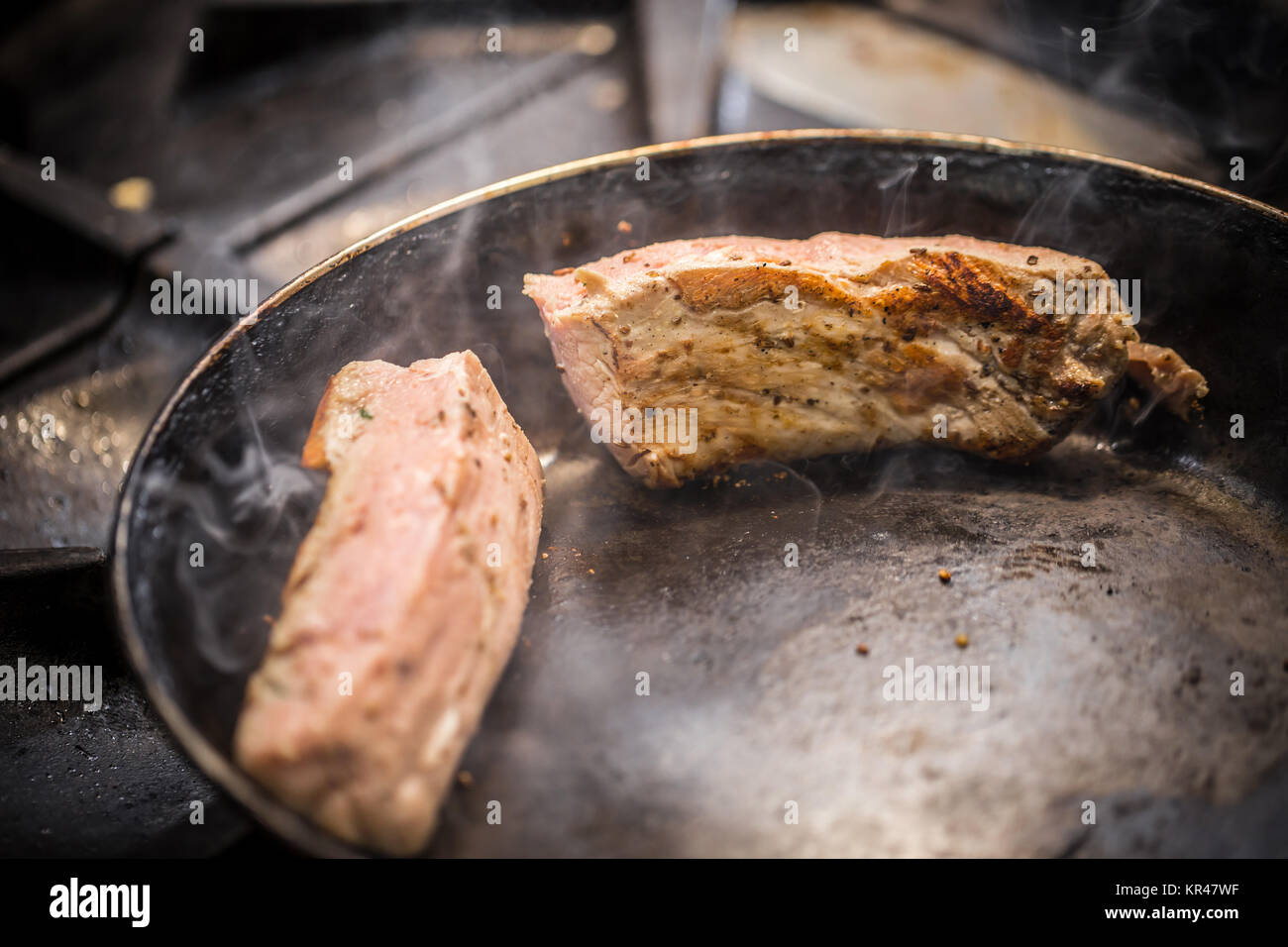 Meat in pan Stock Photo - Alamy