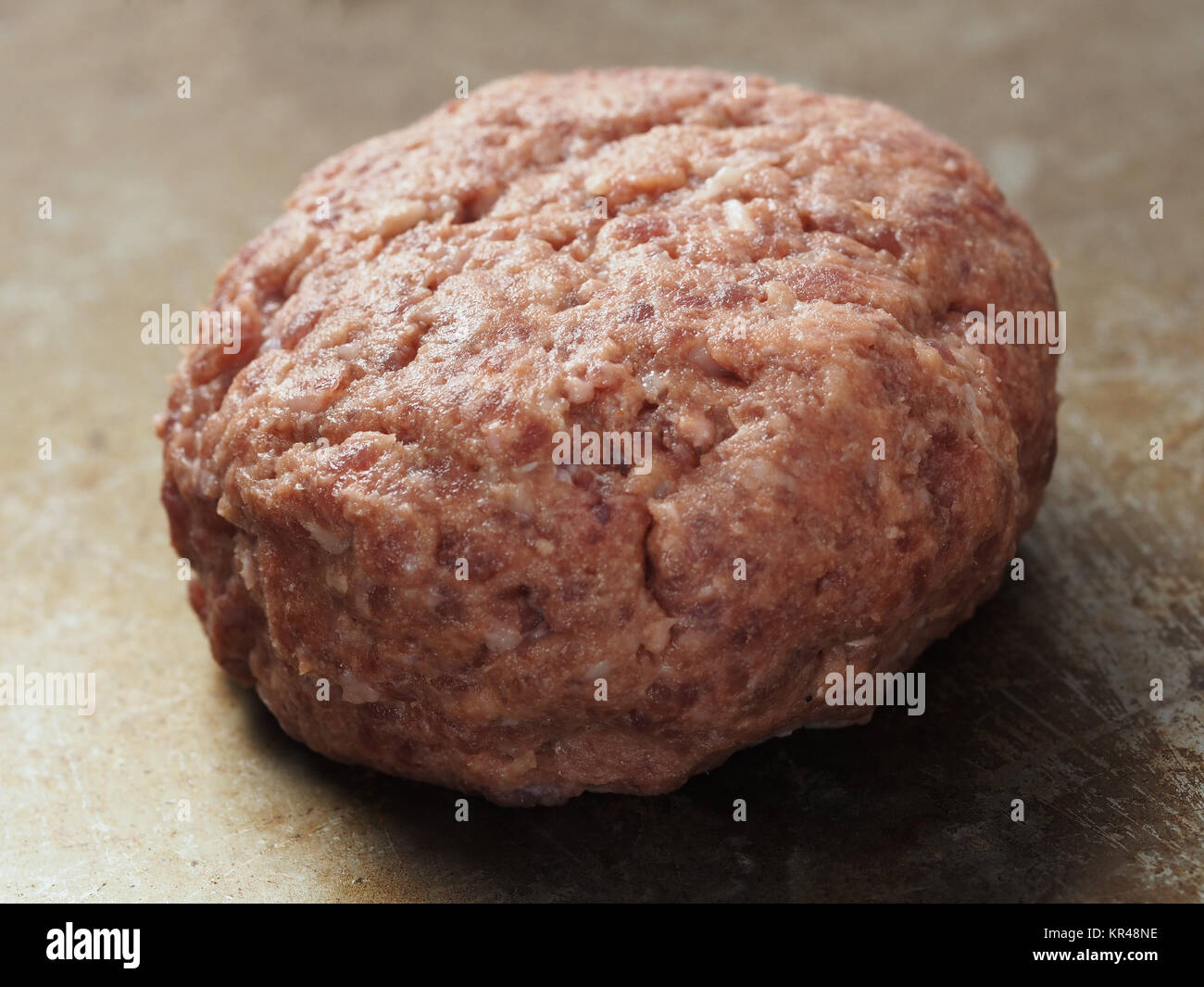 rustic uncooked hamburger patty Stock Photo - Alamy