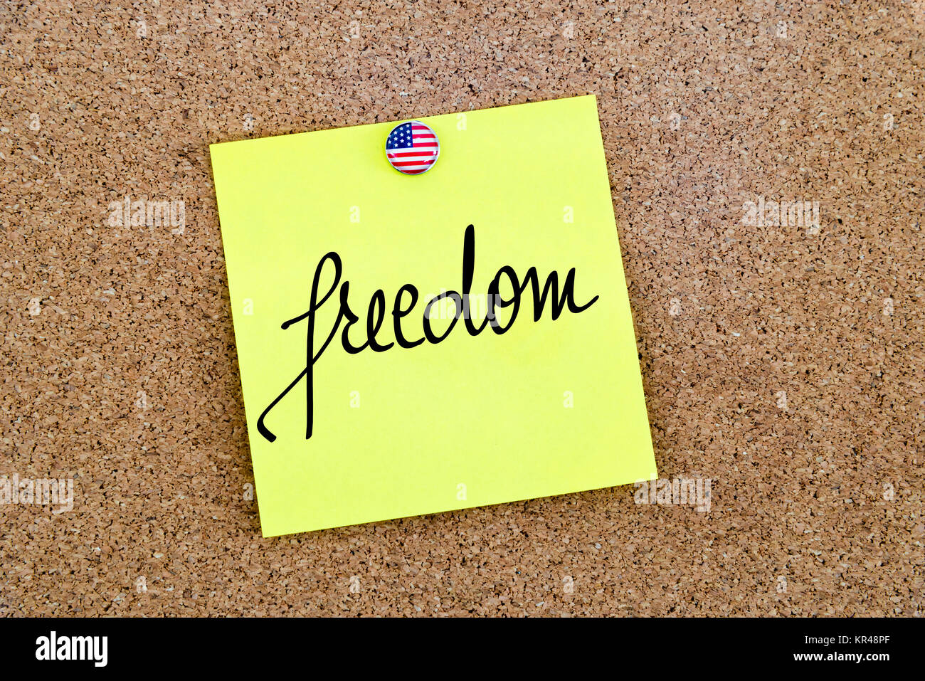 Written text Freedom over yellow paper note Stock Photo - Alamy