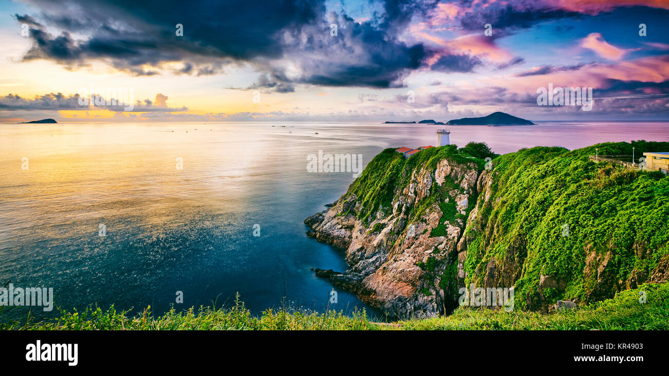 Hong Kong lighthouse during sunrise Stock Photo - Alamy