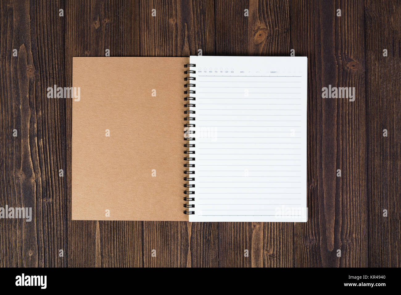 Notebook or empty white paper on wood table top view with copy space ...