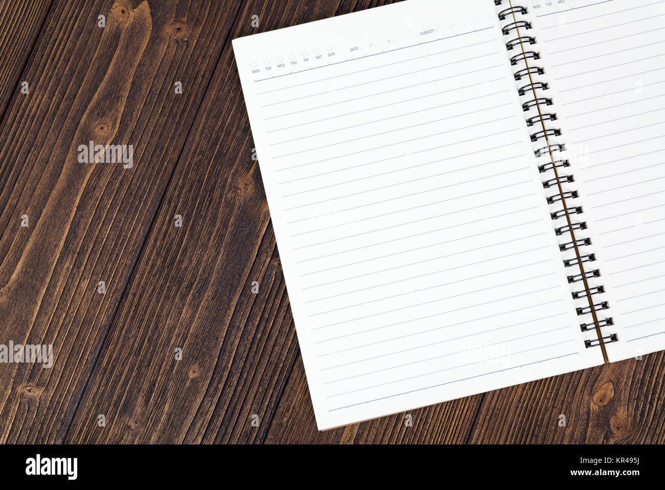 Notebook or empty white paper on wood table top view with copy space ...