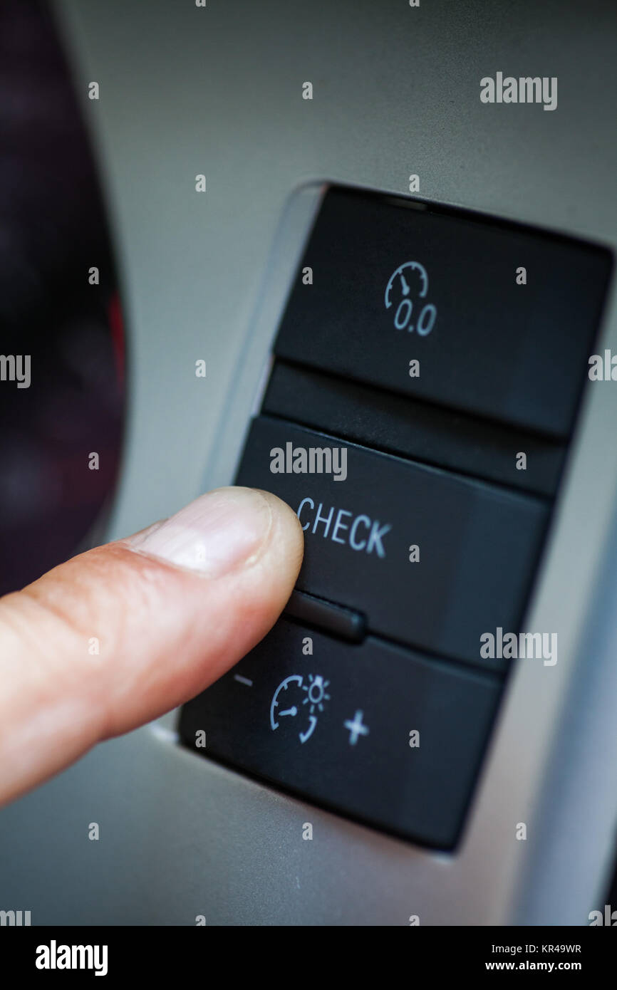 Car check button Stock Photo - Alamy