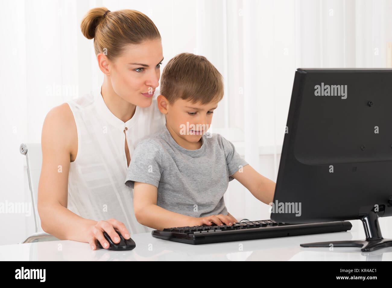 Mother And Son Using Computer Stock Photo - Alamy