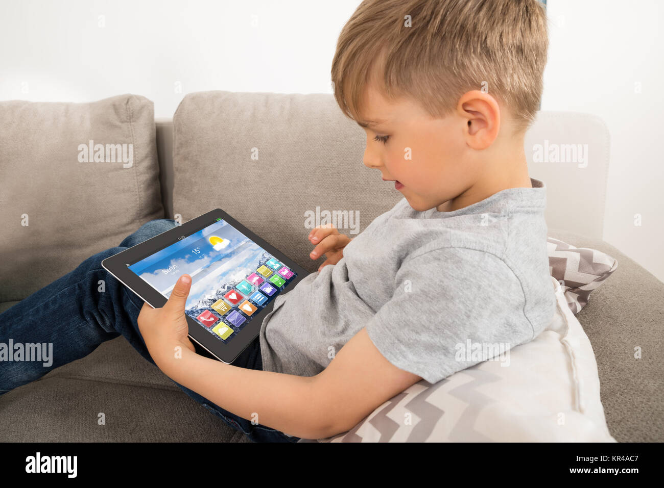 Boy Using Digital Tablet Stock Photo - Alamy