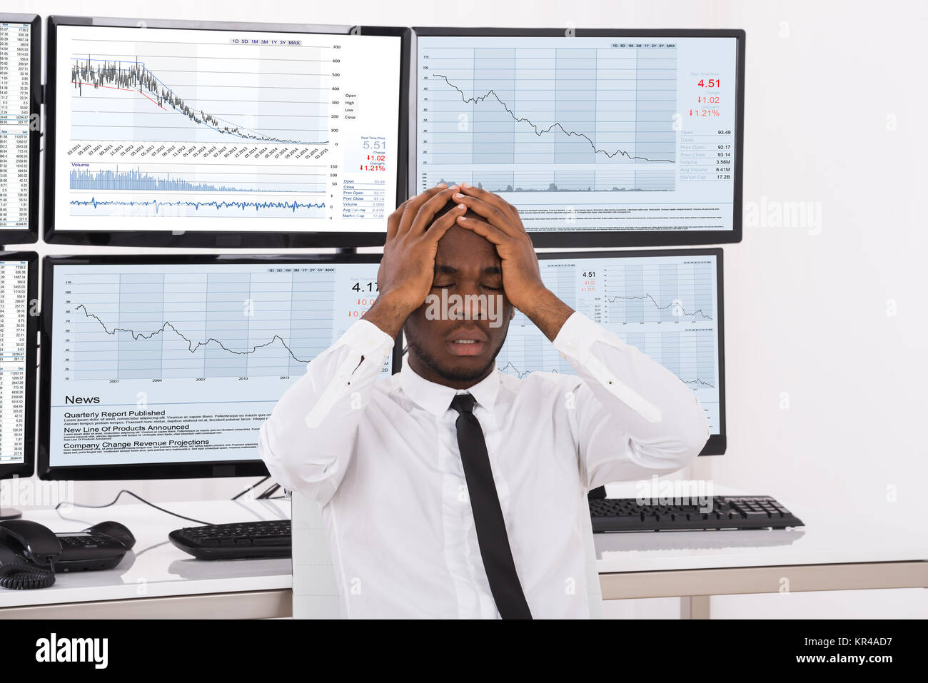 Stock Market Broker With Hands On Head Stock Photo - Alamy