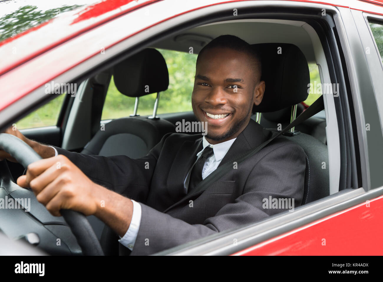 Happy Businessman Driving Car Stock Photo - Alamy