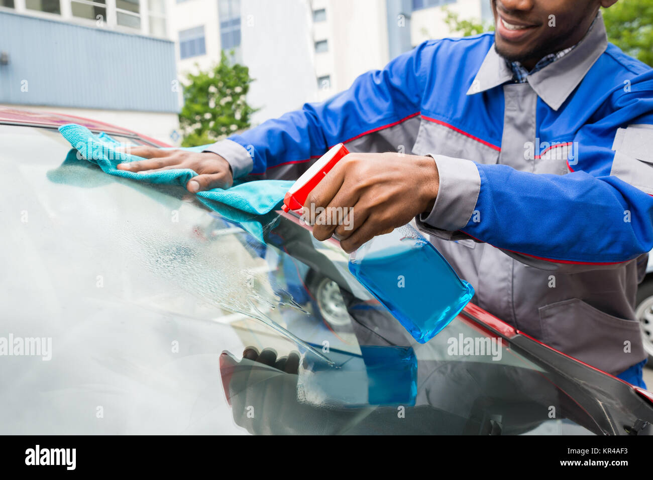Male Worker Cleaning Car Windshield Stock Photo - Alamy