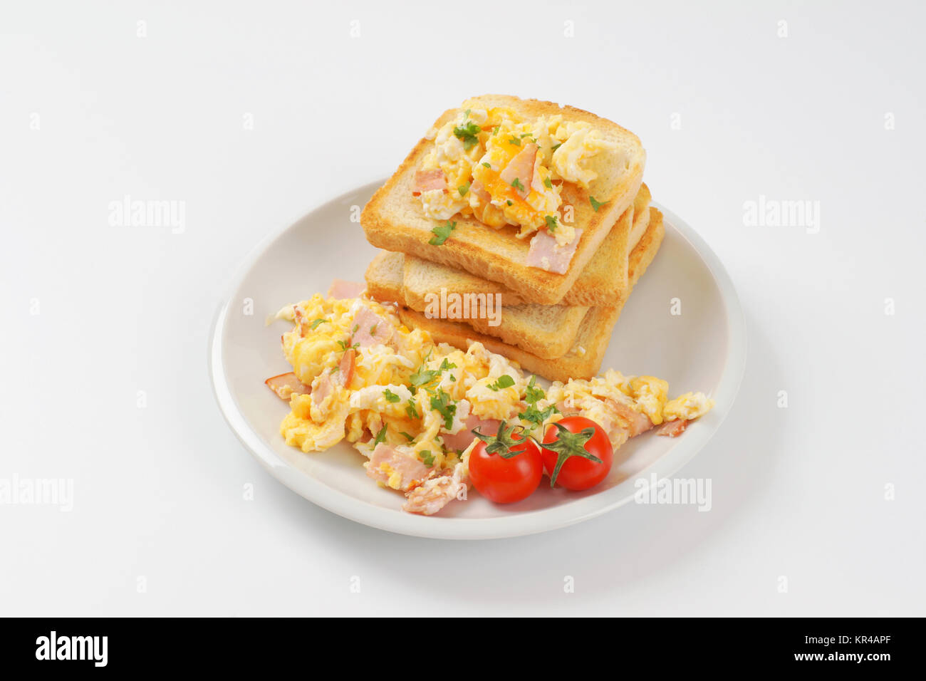 Scrambled eggs and toasted bread Stock Photo - Alamy