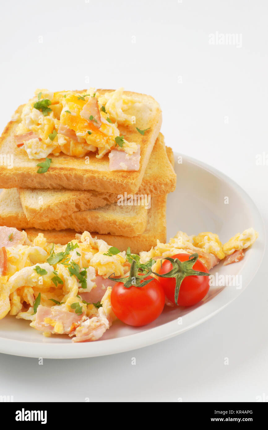 Scrambled eggs and toasted bread Stock Photo - Alamy