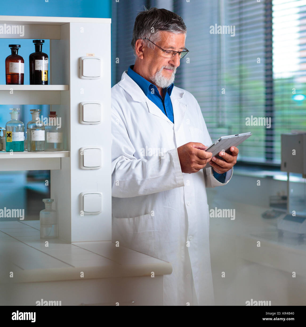 Senior chemistry professor/doctor in a lab (color toned image Stock ...