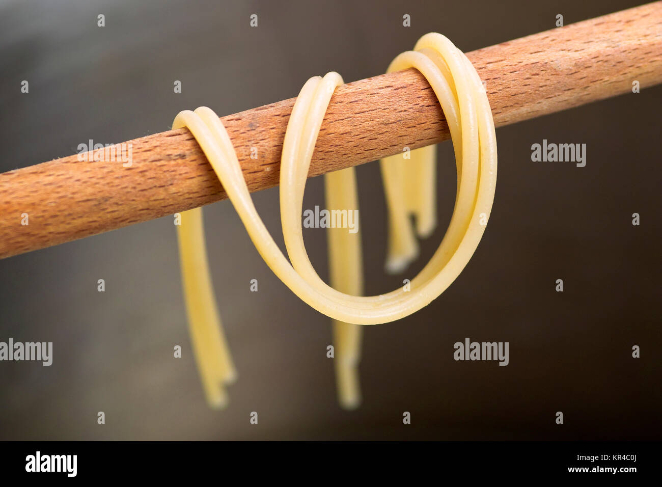 Spaghetti hanging over a spoon Stock Photo - Alamy