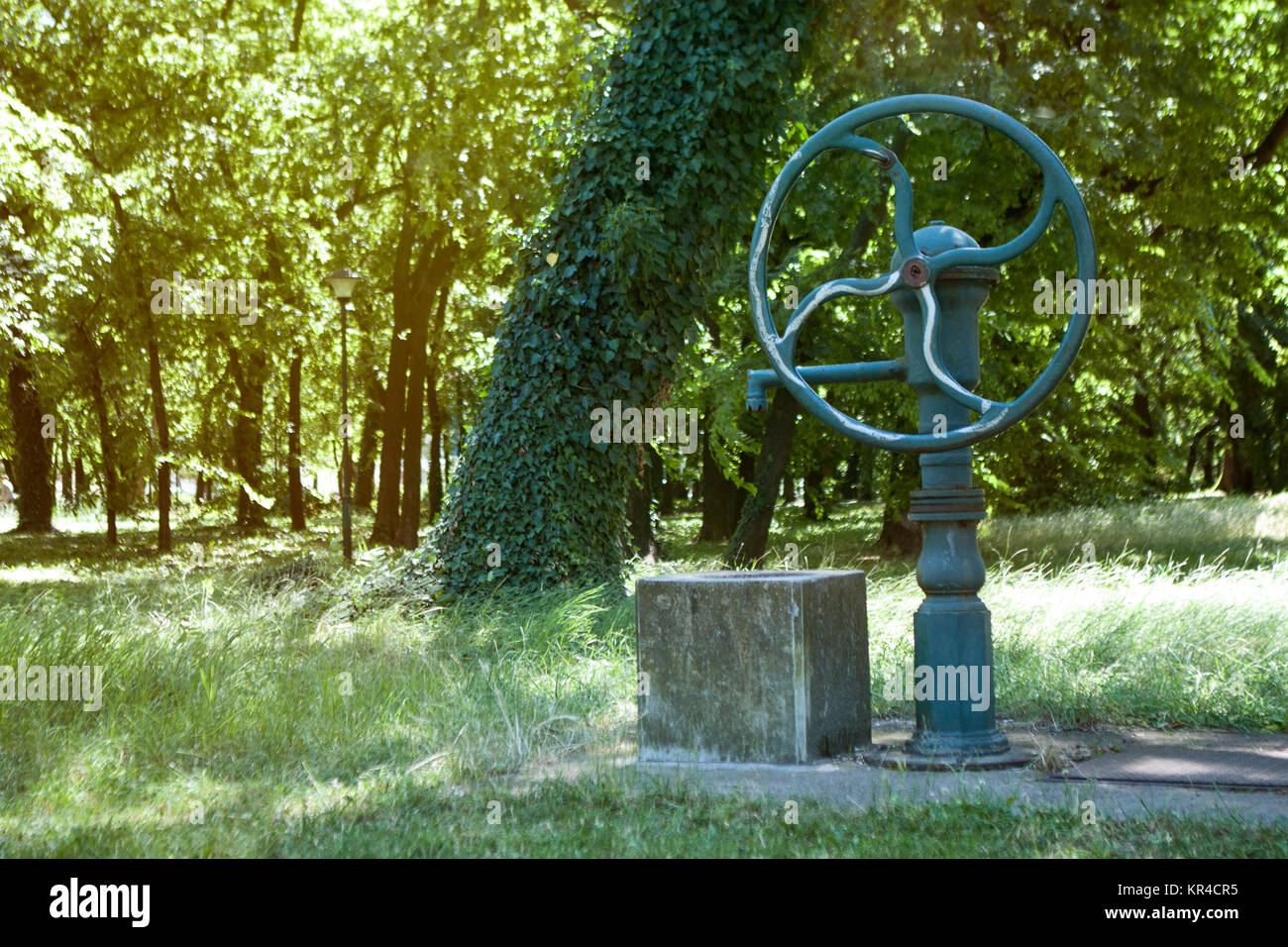 Old style water well and pump for water Stock Photo - Alamy