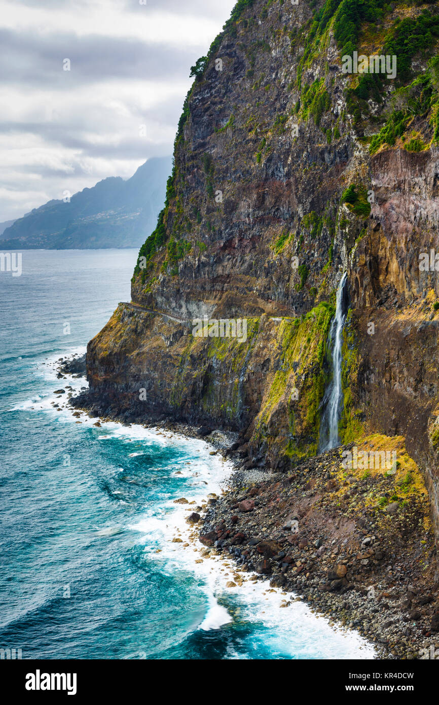 Coastal landscape with a waterfall Stock Photo - Alamy