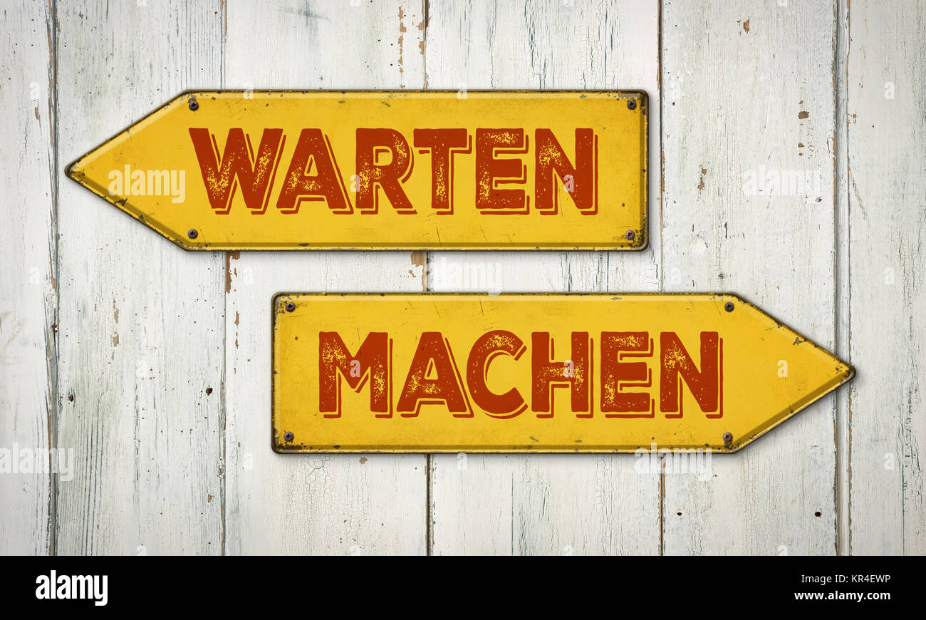 Wegweiser - Warten oder Machen Stock Photo - Alamy