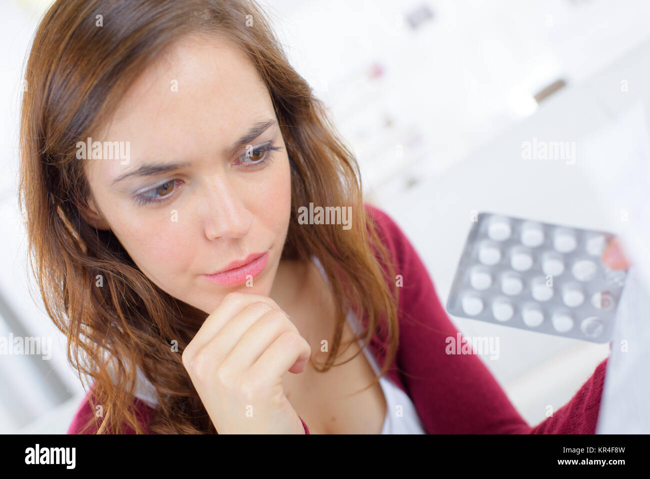 Woman taking a tablet Stock Photo - Alamy