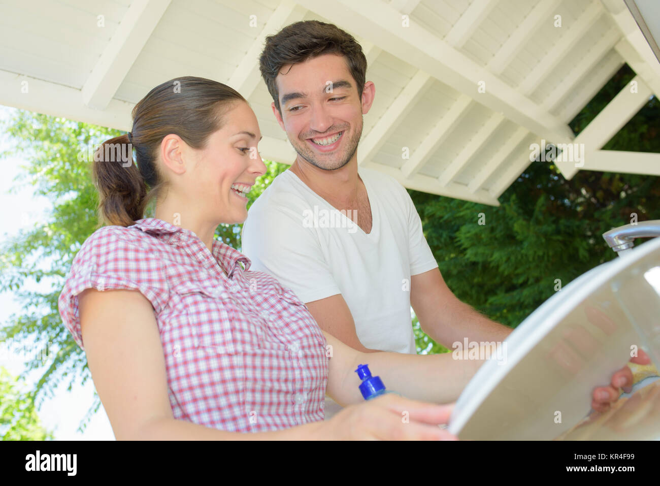 conversation while washing Stock Photo - Alamy