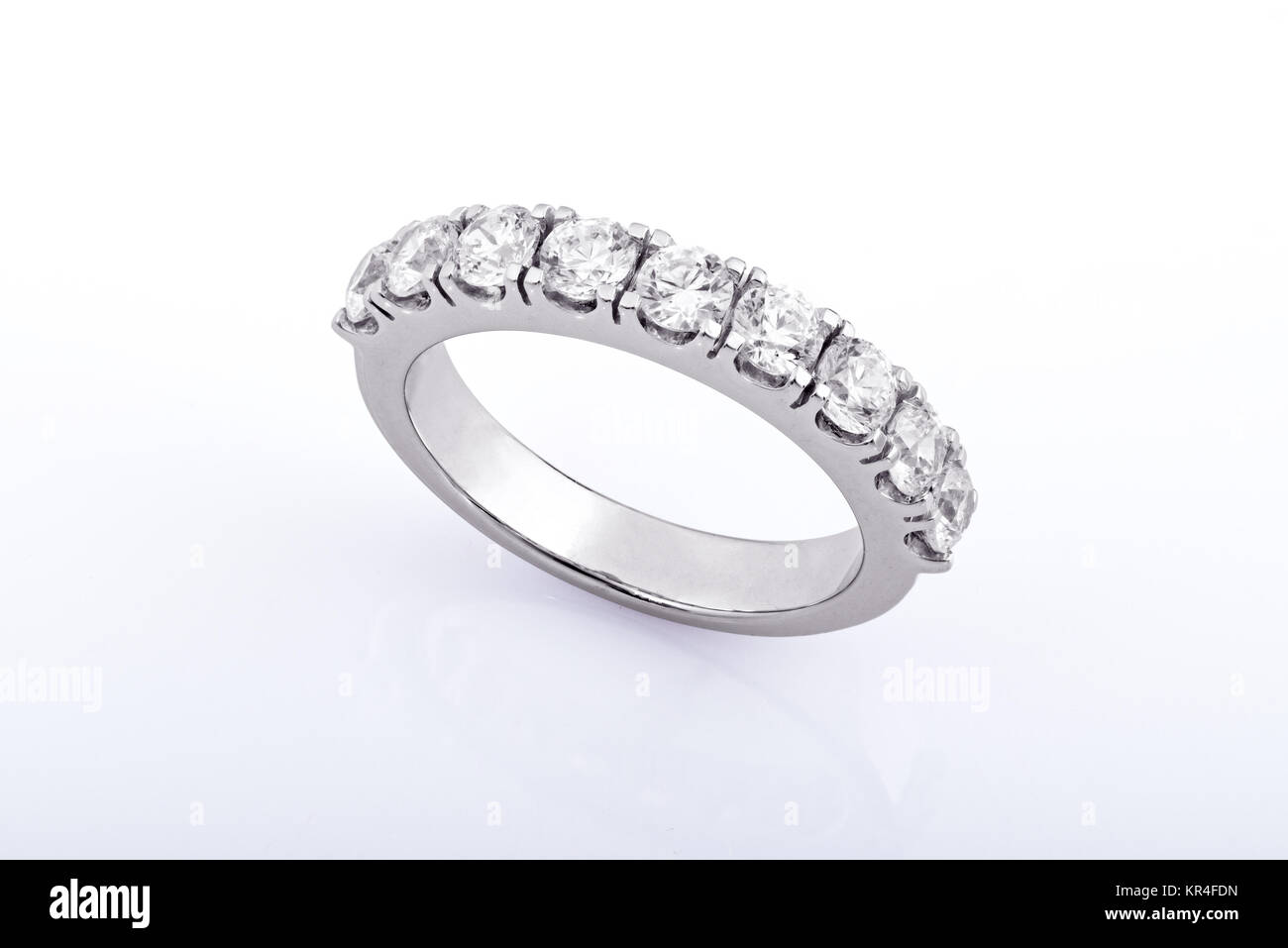 White gold wedding ring with small diamonds Stock Photo - Alamy