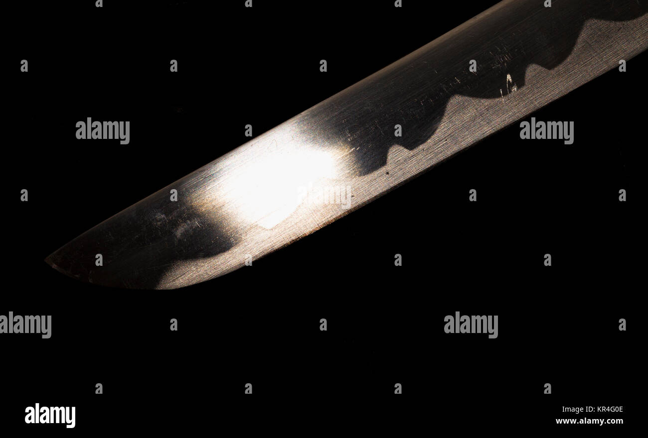 Blade shining in the darkness Stock Photo - Alamy