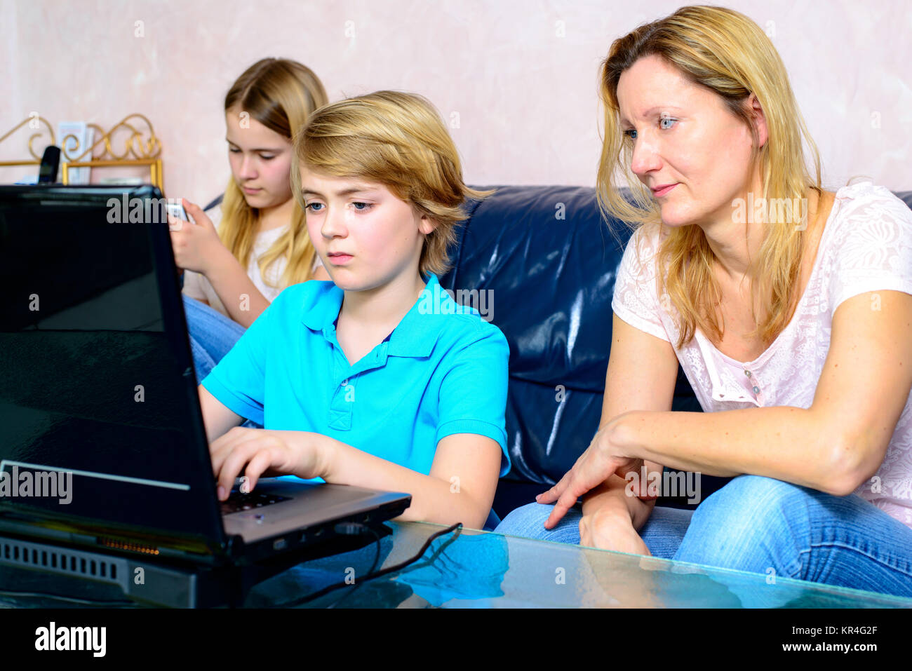 mother and her children using computer Stock Photo - Alamy