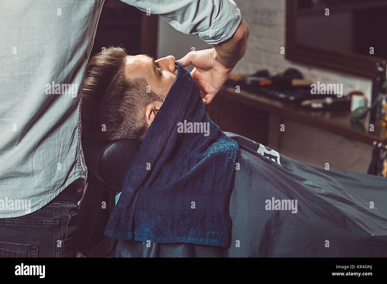 Hipster client visiting barber shop Stock Photo - Alamy
