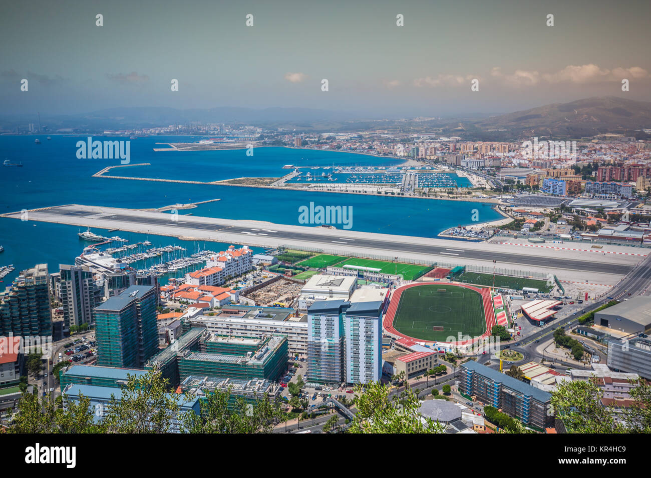 an aerial view of Gibraltar, its marina and the Mediterranean sea as ...