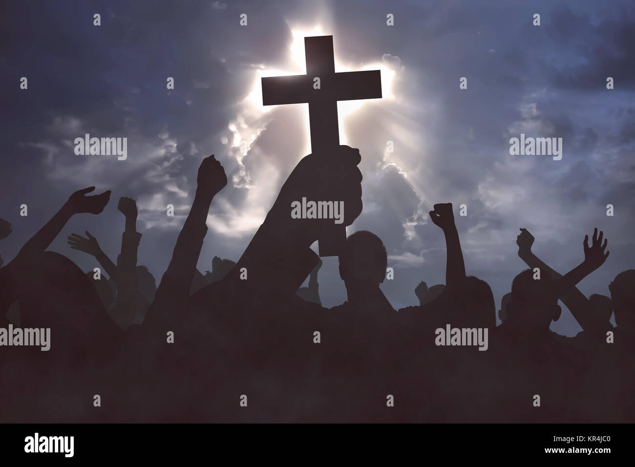Group of christian people praying to Jesus christ with dramatic sky ...