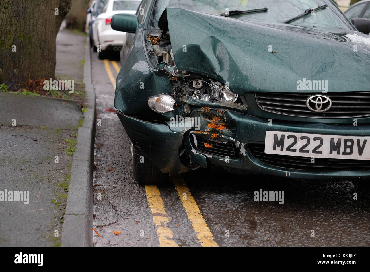 December 2017 - Tree 1 - Car 0, Old green car damaged where it ran into ...